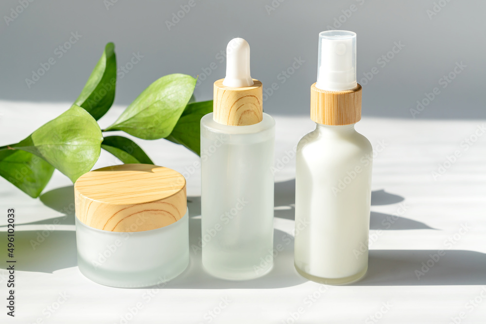 Set of frosted glass cosmetic bottles on white background. dropper ...