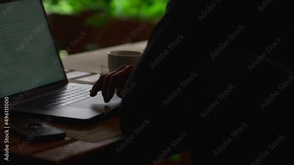 Outside office. Man uses touchpad to scroll through information on ... Outside office. Man uses touchpad to scroll through information on ...