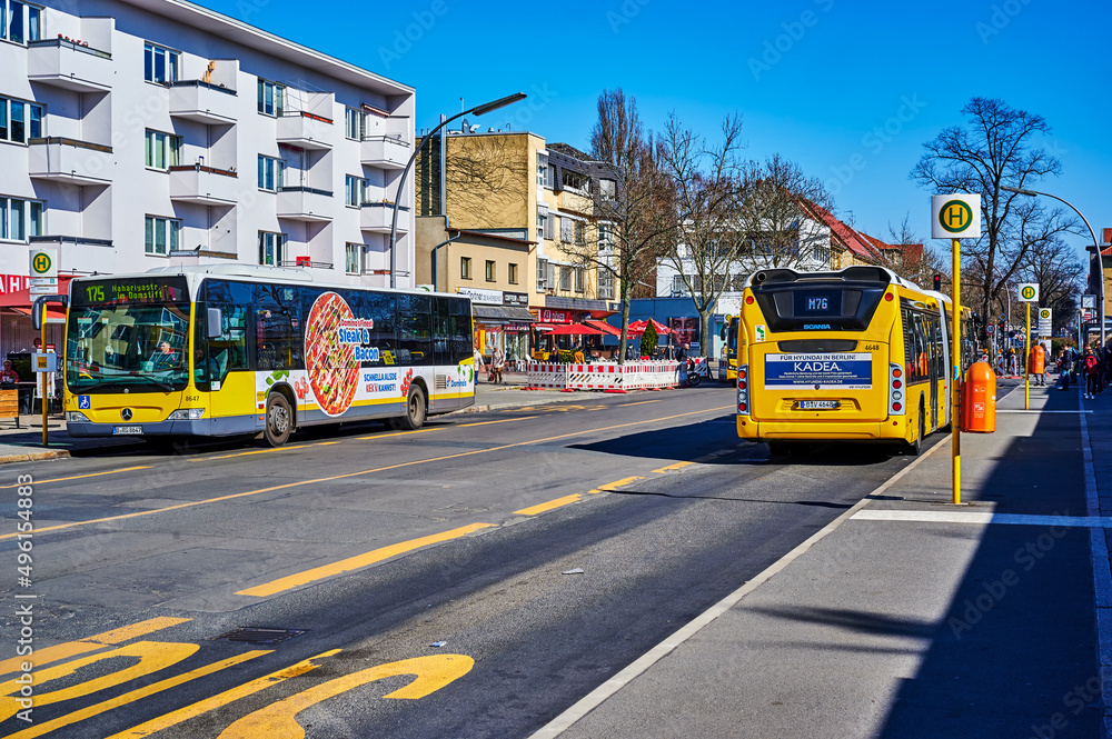 Berlin, Germany - March 22, 2022: Street scene at a bus stop in a small ...