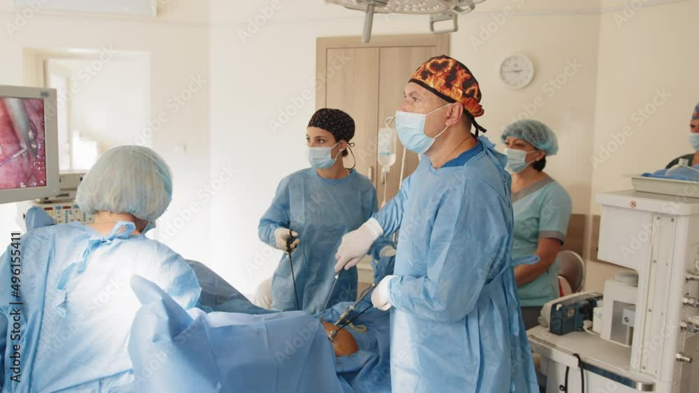 Surgeons team performing operation in hospital operating theater ...