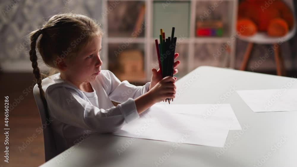 Crying little girl with thin braids gets upset of crayons unfortunate ...