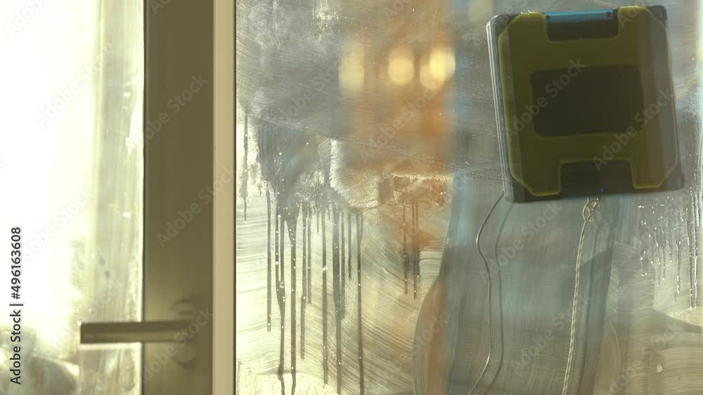 Window with very dirty and dusty glass in daylight. cleaning robot ...