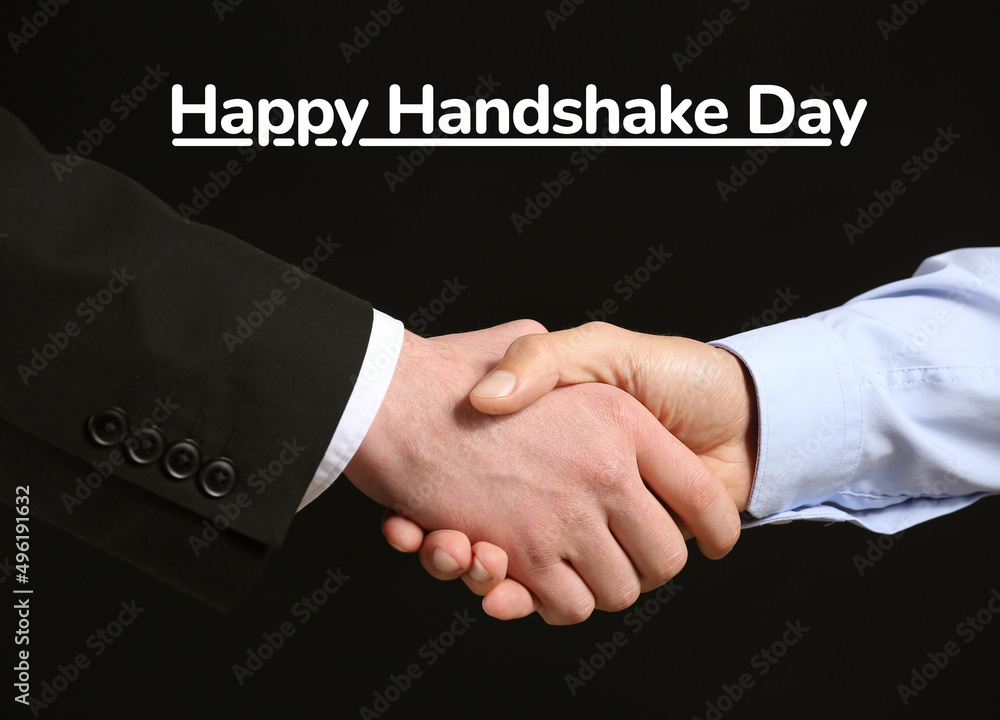 Businessmen shaking hands on black background. Happy Handshake Day ...