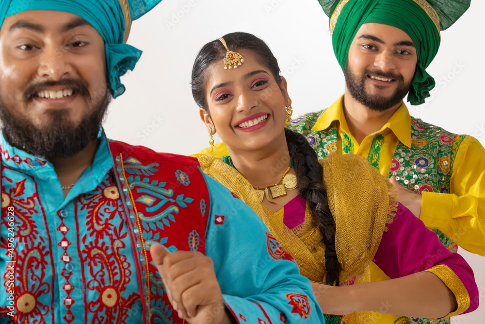 Sikh people performing bhangra together during Baisakhi celebration ...