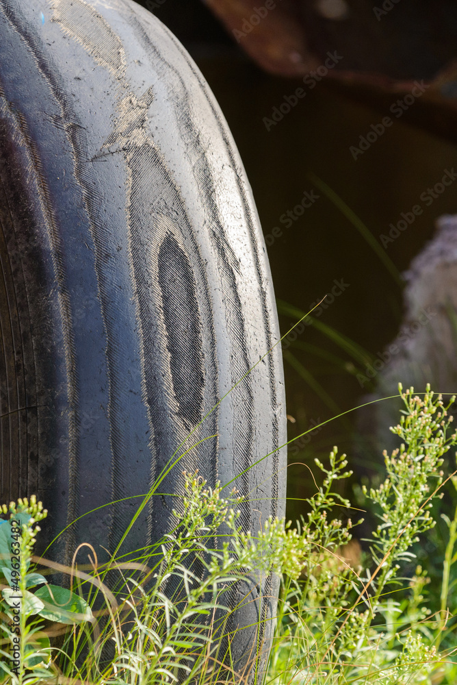 Old worn out truck tire with abrasions and layers of rubber Stock Photo ...