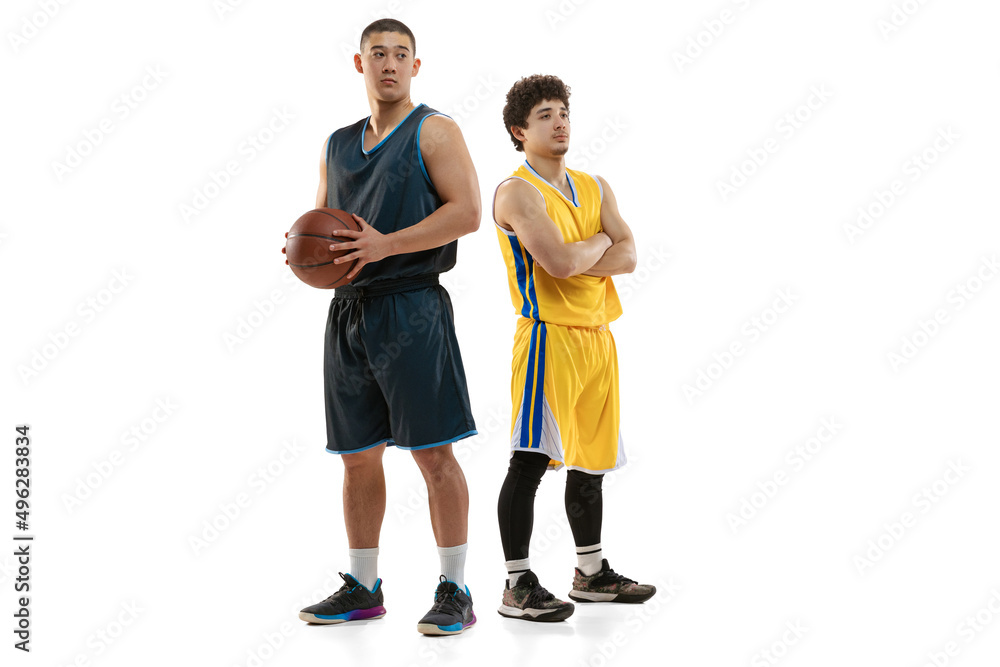 Portrait of two young basketball players posing isolated on white ...