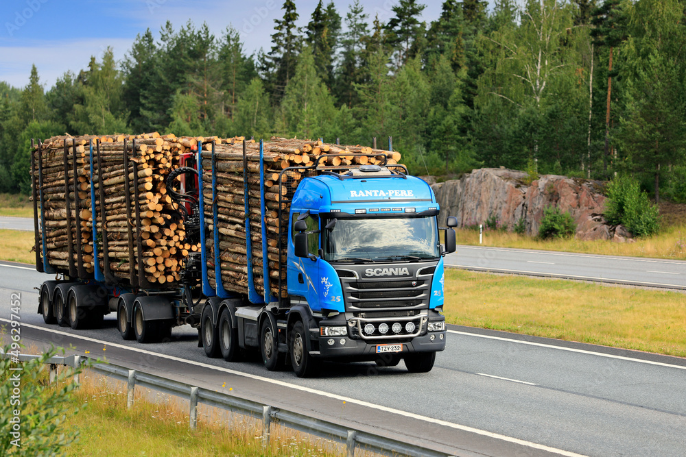 Blue Scania Logging Truck Hauls Pulp Wood on Highway Stock Photo ...