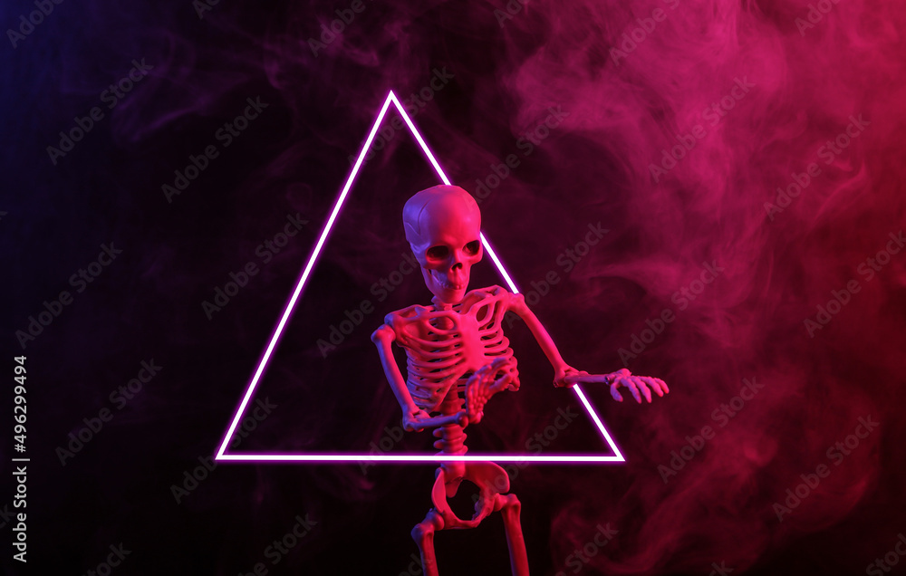 Skeleton in dense smoke, triangle with red blue neon light. Scary ...