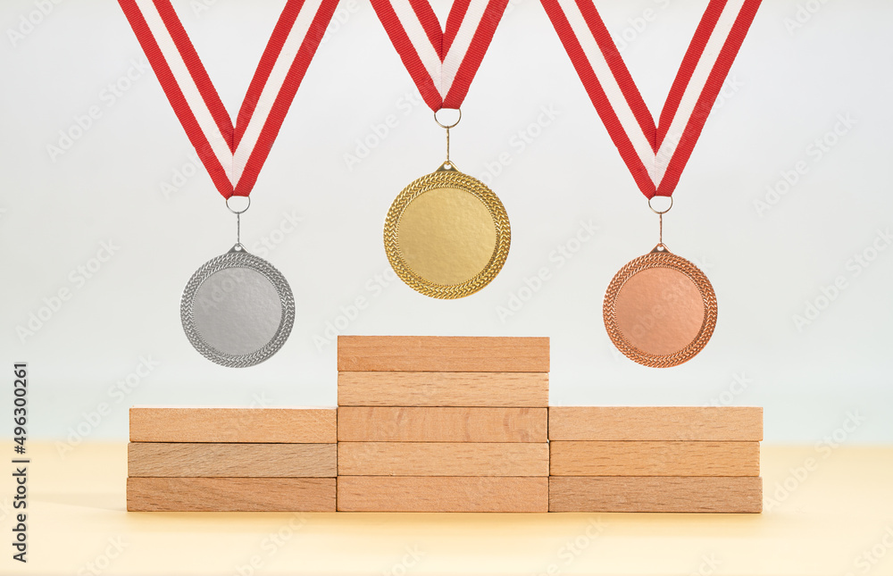Platform made of wooden blocks and gold silver and bronze medals as a ...