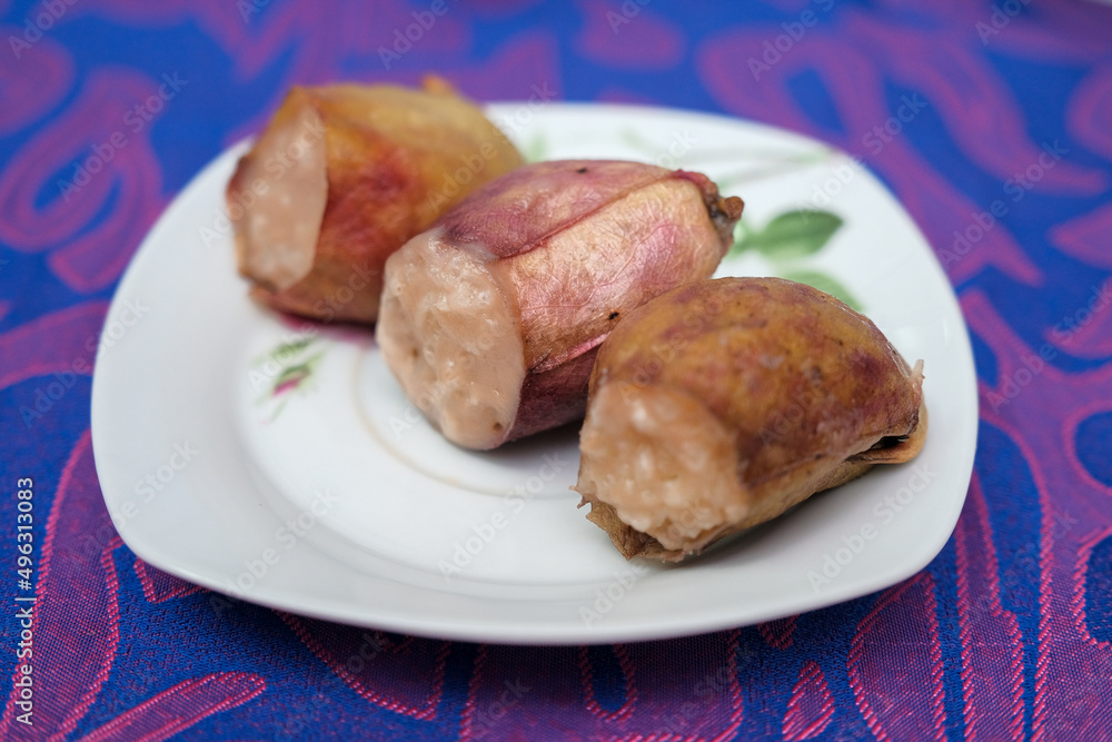 Glutinous rice steamed cooked with coconut milk in pitcher plants known ...