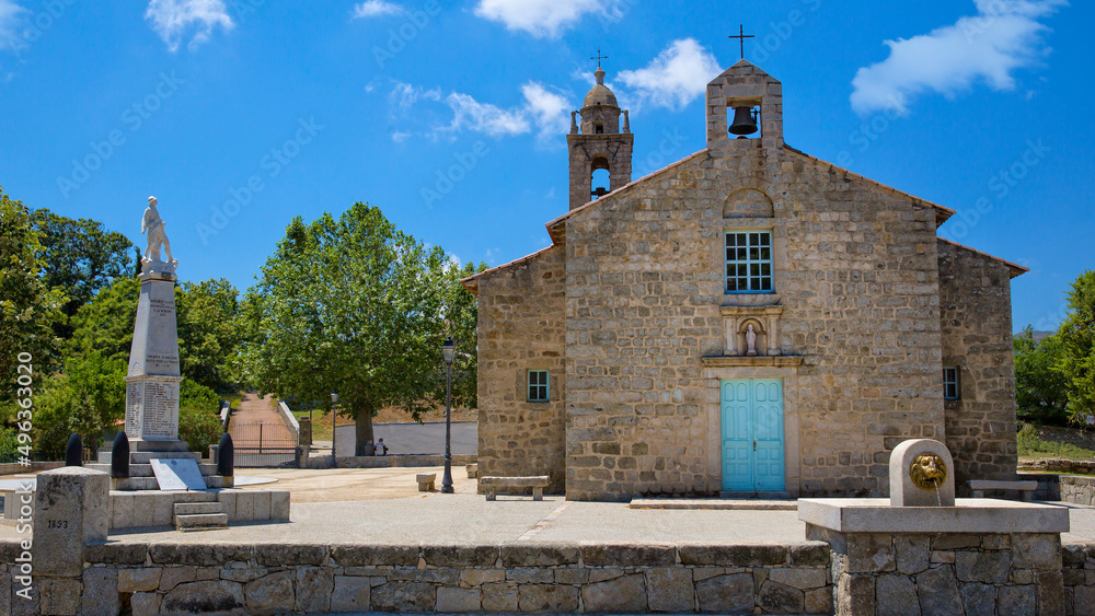 The church square of the small village Quenza. The Saint George parish ...