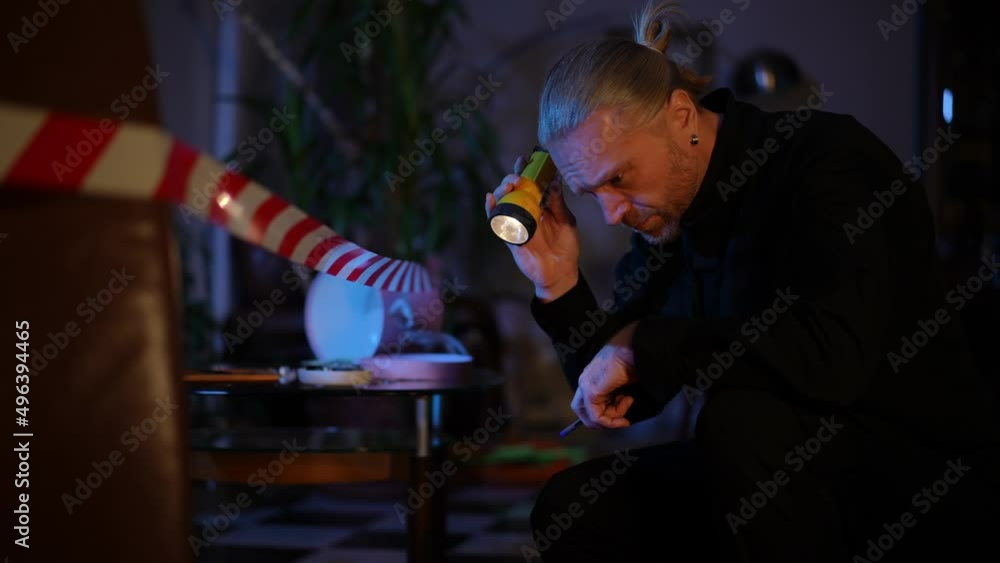 Side view portrait of serious concentrated cop investigating crime ...