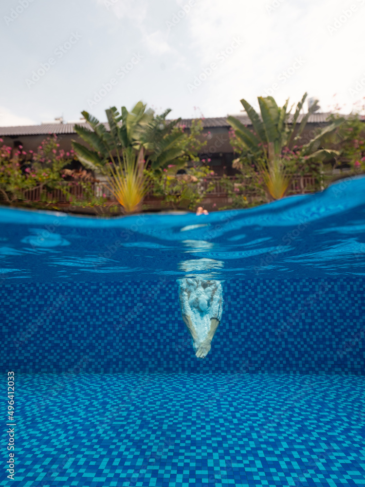 Split Photography: A man dives into the swimming pool in a tropical ...