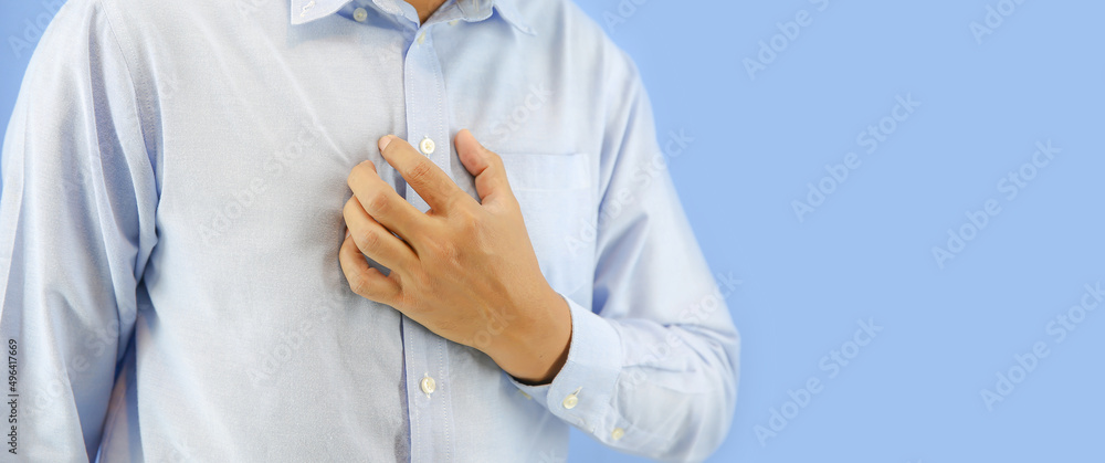 Hand holding the chest concepts of burning chest pain or sensation in ...