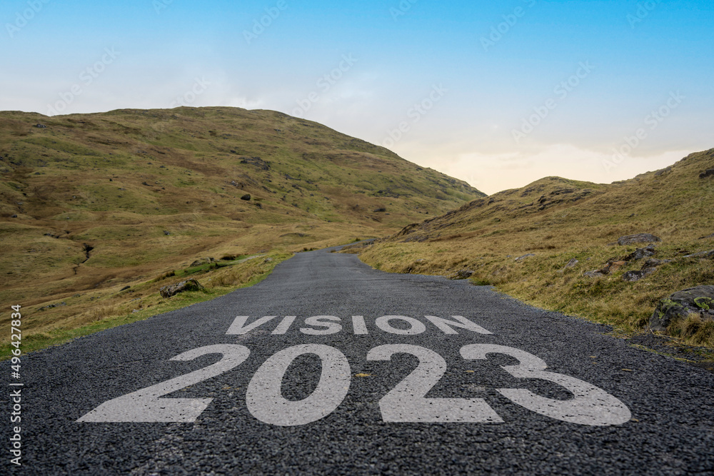 Vision 2023 written on a mountain pass road in the Lake District. Stock ...