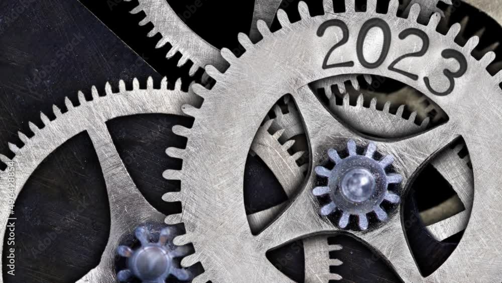 Rotating tooth wheel with New Year 2023 imprinted on metal surface ...