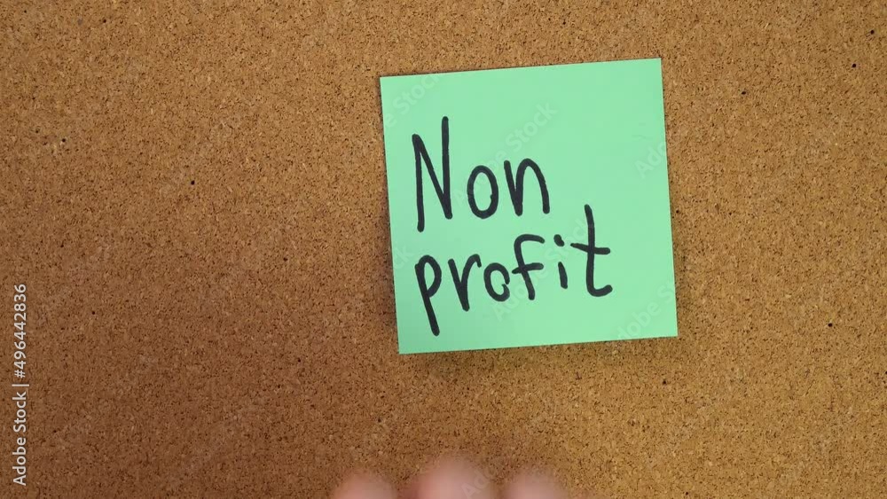 non profit Stick the sticker on the cork board. Top view of note board ...