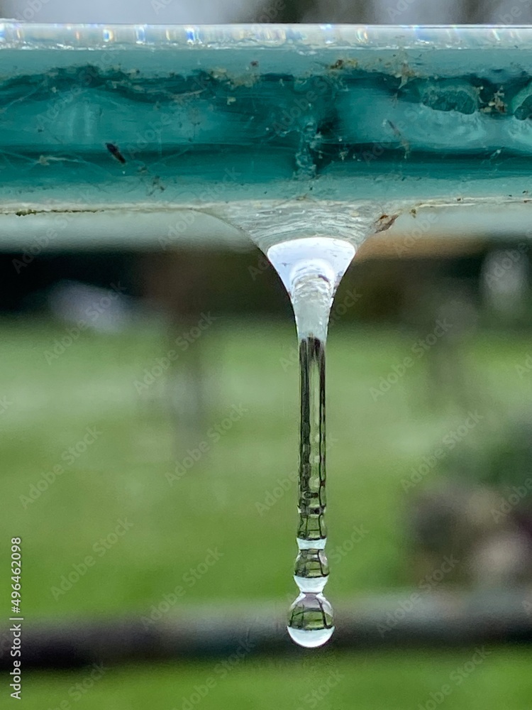 water drop dripping off edge background reverse reflection in water ...