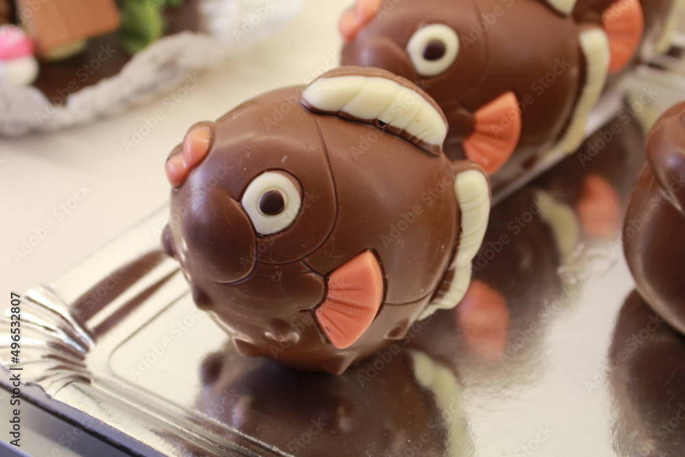 Chocolate figure in the shape of a fish or a blowfish. Chocolate pieces ...