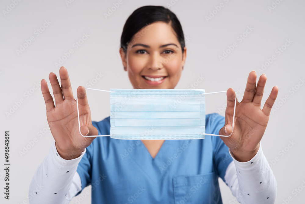 Lets cover your face to save the world. Portrait of a young doctor ...