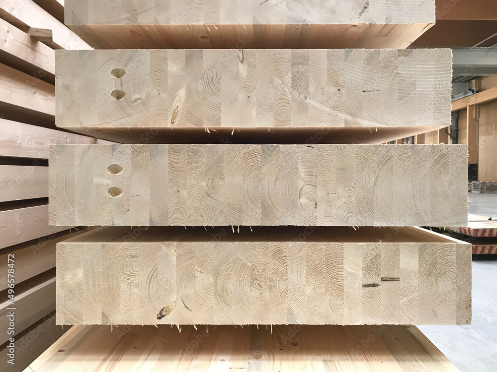 stack of Engineered wood timber beams. Mass Timber glulam construction ...