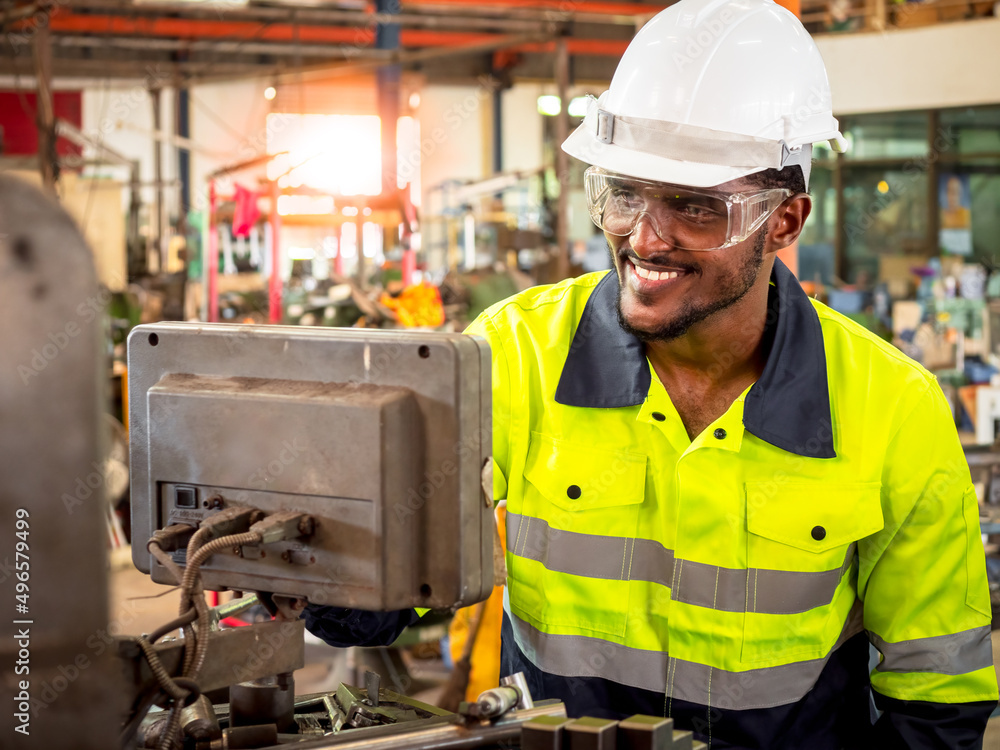 Men industrial engineers wearing a white helmets while standing in a ...