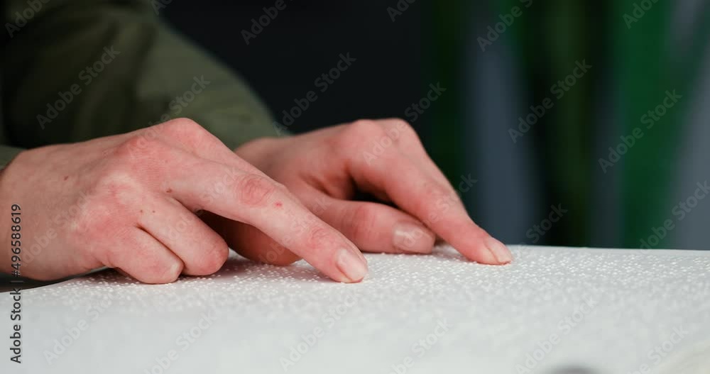 Blind man reading a text of Braille. Braille is a tactile writing ...