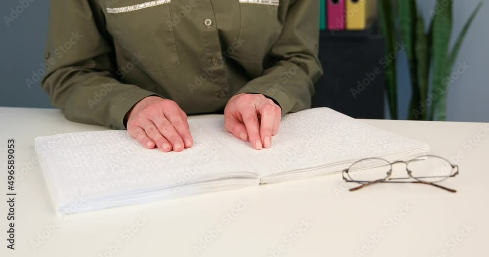Blind man reading a text of Braille. Braille is a tactile writing ...