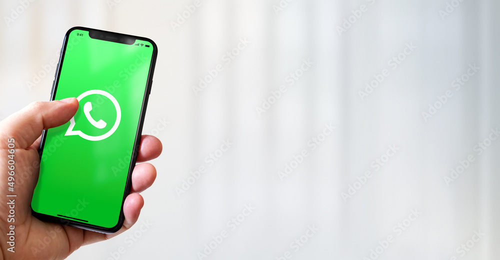 Hand holding iphone smartphone with WhatsApp logo, Paris, France Stock ...