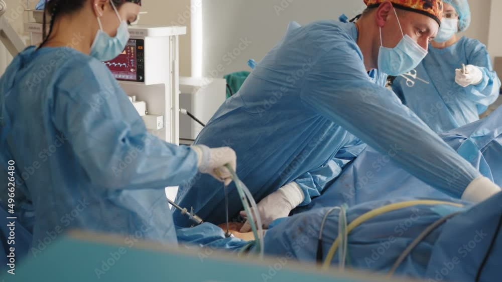Surgery operation using medical instruments in operating room looking ...