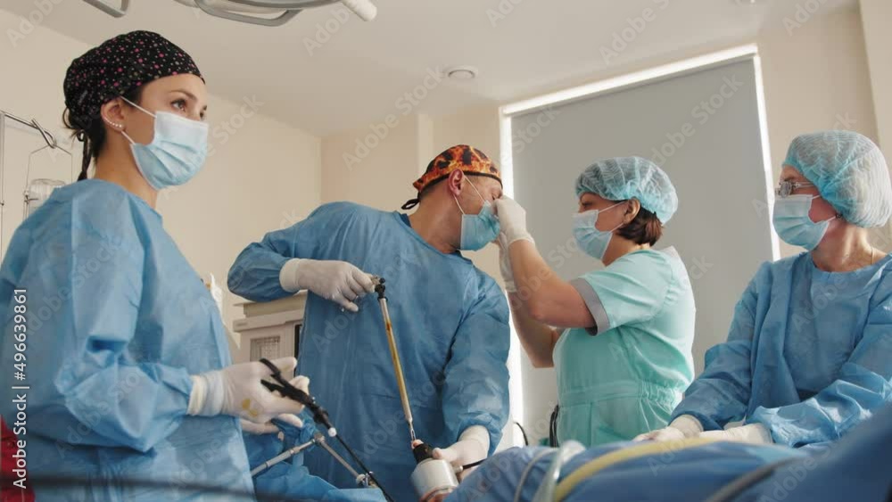 Surgical Team Working In Operating Theatre. During the operation in the ...