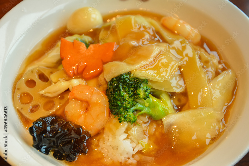 Beijing style Chinese noodle and rice soup with oyster sauce, quail egg ...