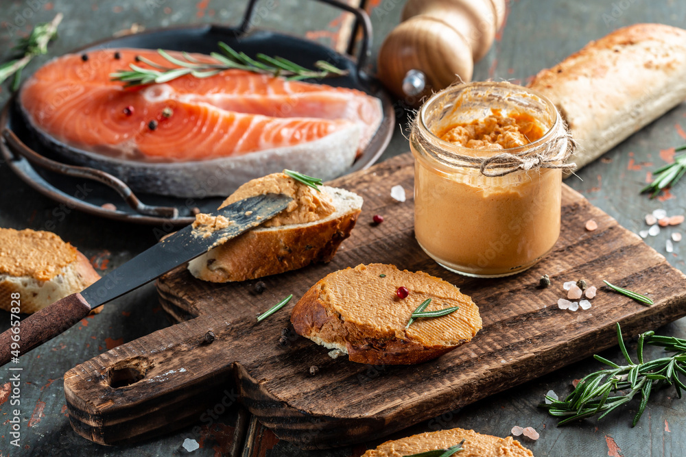 Homemade pate, spread or mousse, paste in a jar on toast wooden ...