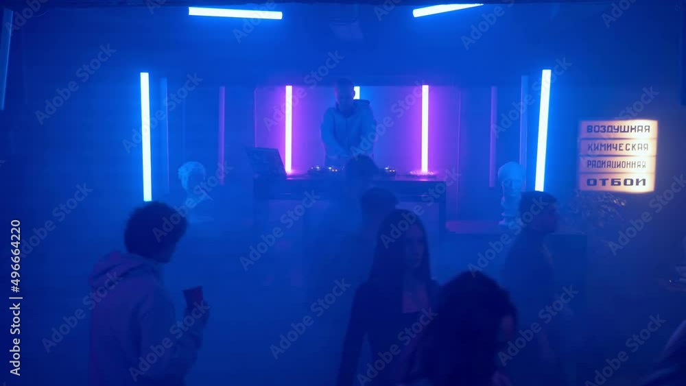 A Crowd Of People Leaves The Dance Floor Of A Nightclub Under The Light