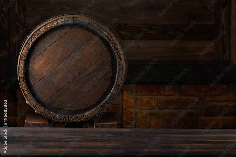 Rustic barrels for beverage in a dark wine cellar. Wooden empty ...
