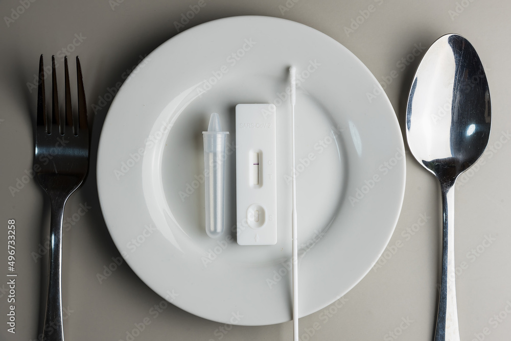 Top view of ceramic plate with Rapid Antigen Test kit with Negative ...