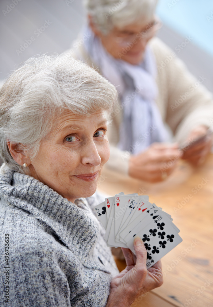 Helping the time pass with card games. Shot of senior citizens playing ...