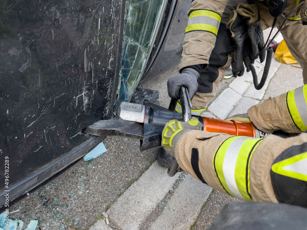 The rescue team of firefighters at the scene of the traffic accident of ...