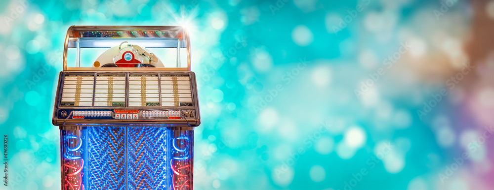 Vintage colorful jukebox in front of blue background with bokeh Stock ...
