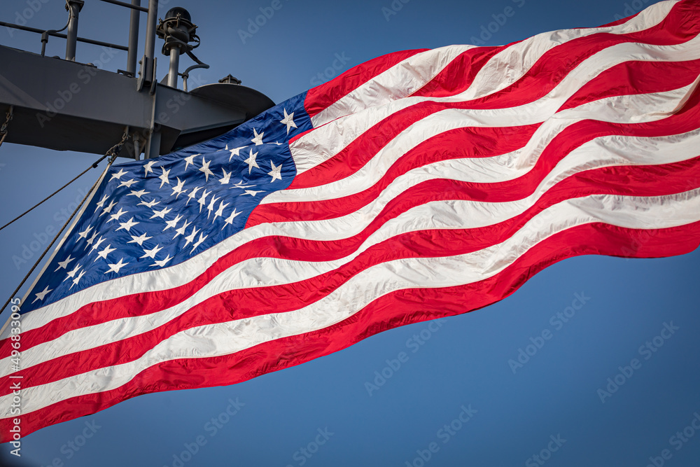 American flag waving from US Navy ship at sea while underway Stock ...