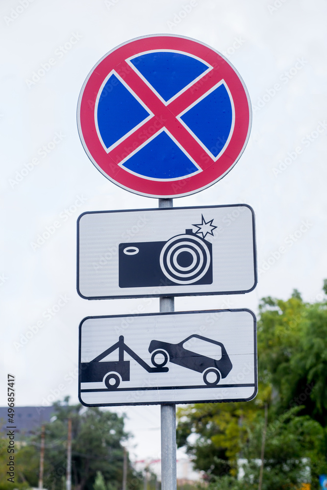Traffic signs: car evacuation, no parking, surveillance camera ...