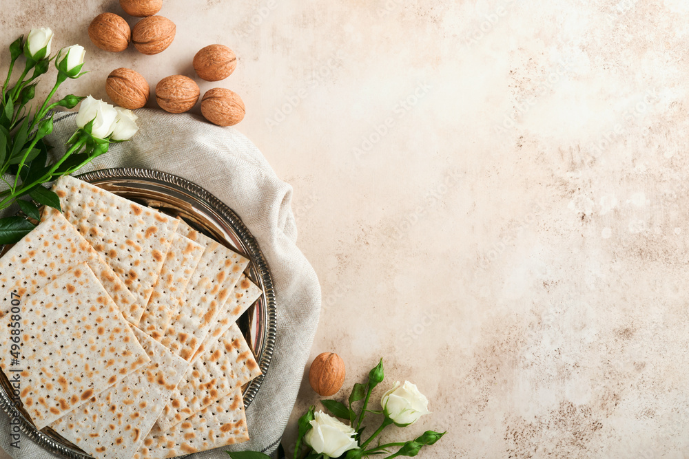 Passover celebration concept. Matzah, red kosher walnut and spring ...