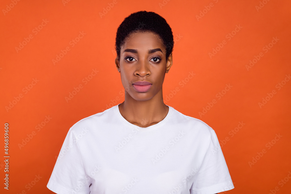 Portrait of woman with transgender appearance look in camera isolated ...