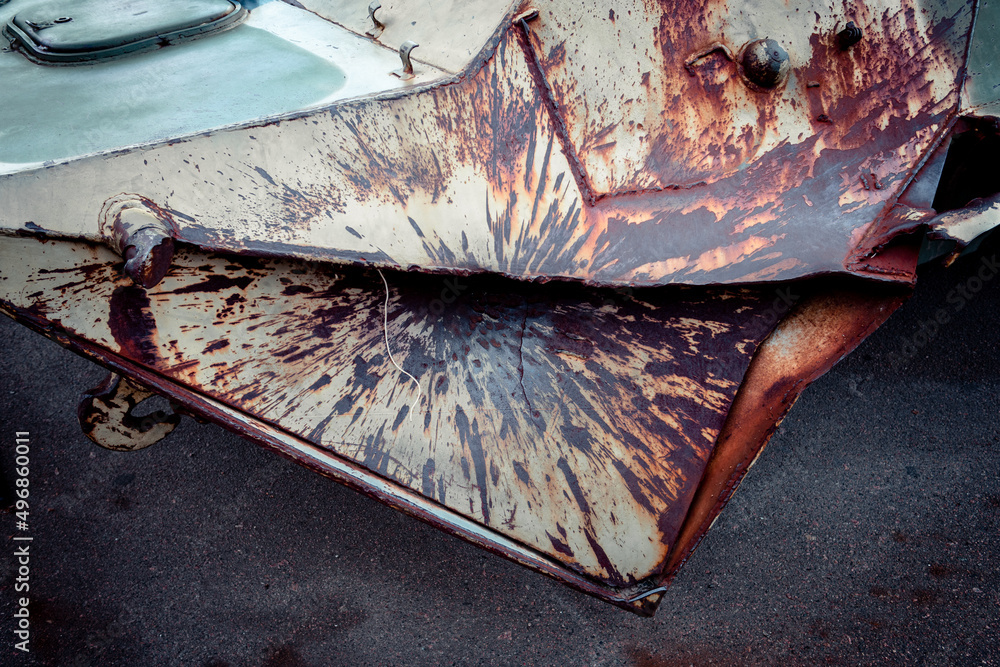 Armoured vehicle damaged by a shell. A trace from a shell hitting an ...