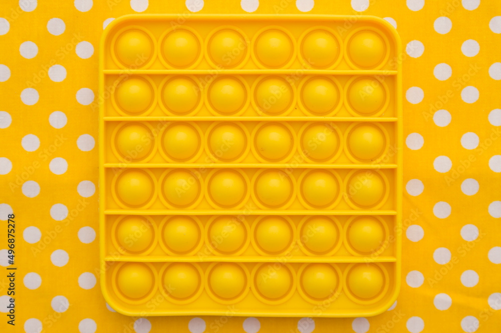 Sensory fidget toy "Pop-it". Instrument for fine motoric skils, tool to ...