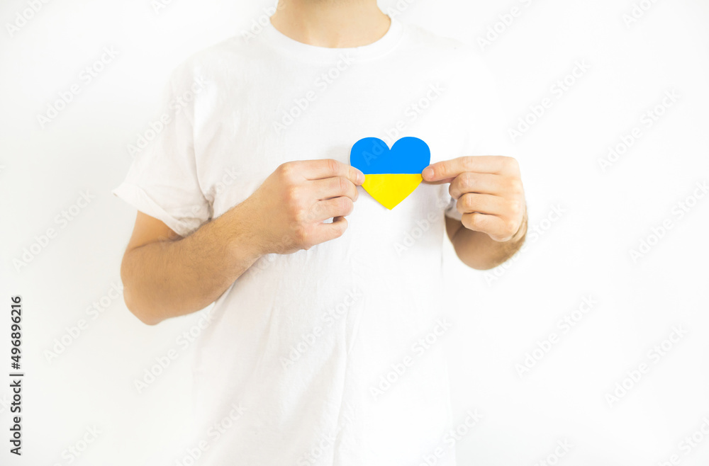 Love Ukraine concept. Hands in the shape of a heart are painted in the ...