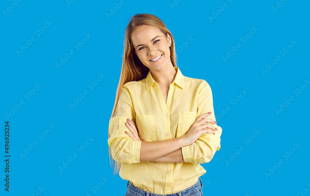 Studio portrait of a cheerful smiling woman in casual clothes. Happy ...