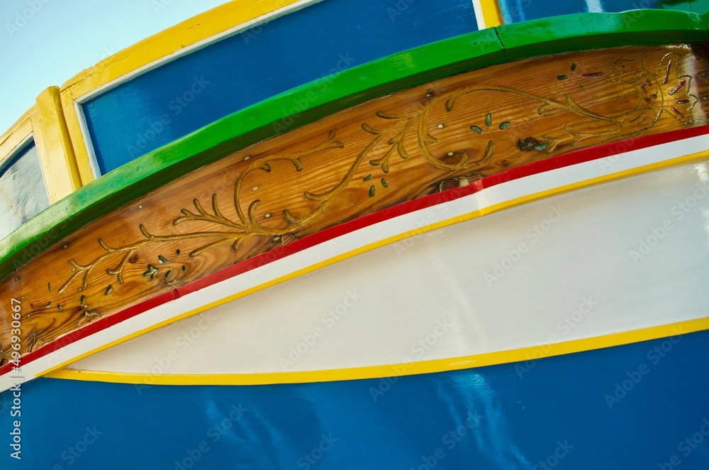 Part of the hull of a brightly colored fishing boat from Malta. Stock ...