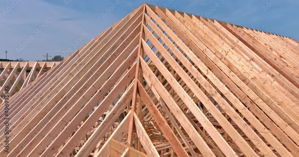 Newly built wooden skeleton frame of house roof section view in ...
