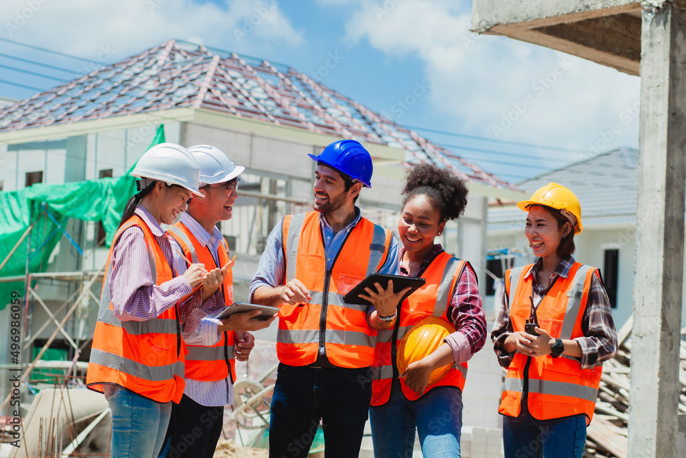Diverse team of experts on the construction site. Real estate project ...